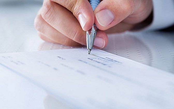 One-Cheque Rent Payment in Dubai: Laws, Pros & Cons | dubizzle